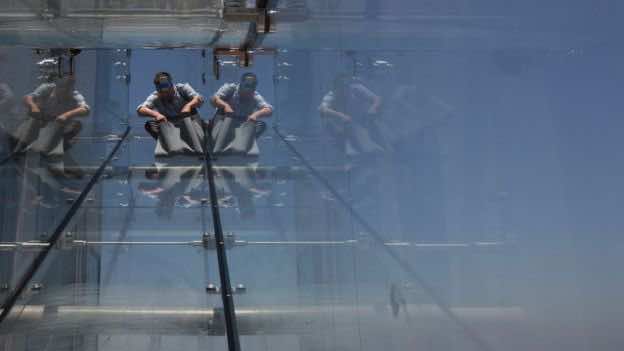 Riding This 1000ft-High Glass Slide Atop A Skyscraper In LA